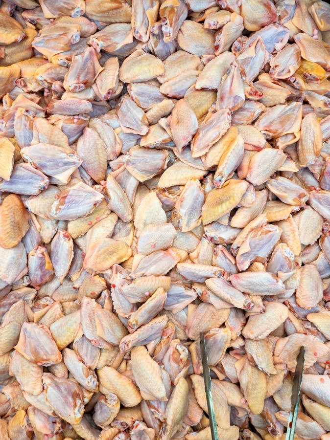 Raw Chicken Wings Pile Up on Stall Stock Photo - Image of poultry ...