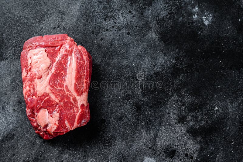 Raw Chuck Eye Roll Steak. Organic Beef. Black Background. Top View ...