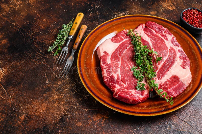 Raw Chuck Eye Roll Steaks Organic Beef Meat. Dark Background. Top View ...