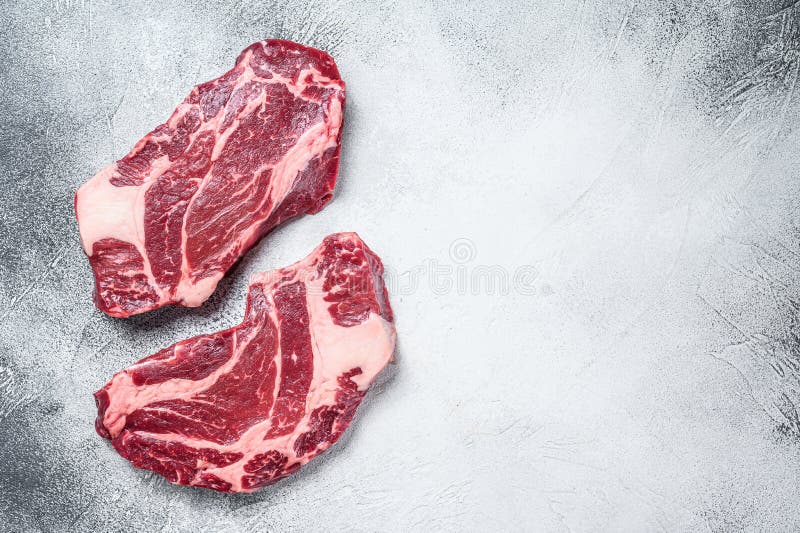 Raw Chuck Eye Roll Steaks Premium Beef Meat. White Background. Top View ...
