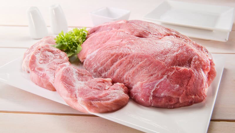 Raw Chuck Steak with Tableware on a Table Stock Photo - Image of steak ...