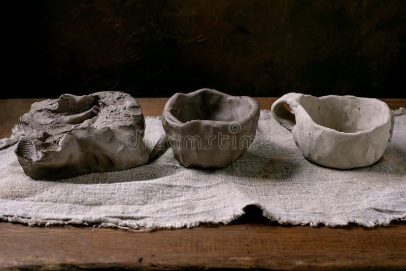 Raw clay and cups stock image. Image of handcrafted - 344929331