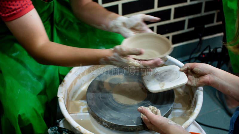 A Raw Clay Pot in the Hands of a Potter. Workshop in the Pottery ...