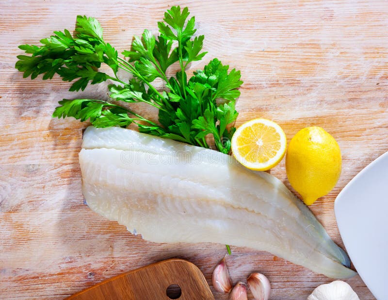 Raw Cod Fillet with Greens and Spices Stock Photo - Image of cutting ...