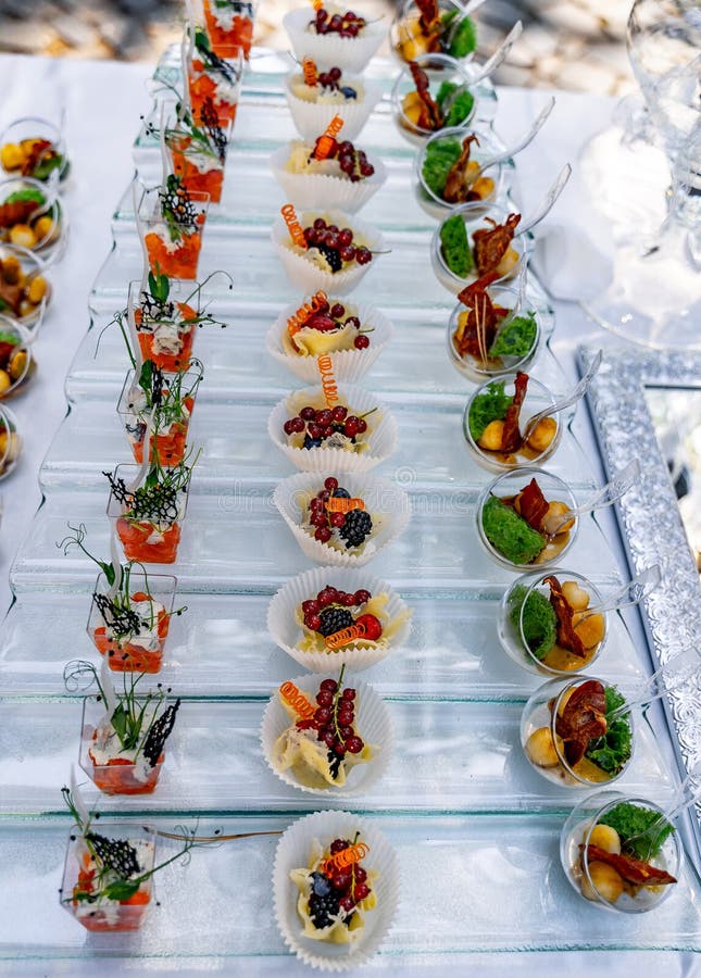 Raw of Cold Snacks on Table. Catering and Appetizers. Luxurious Food on ...