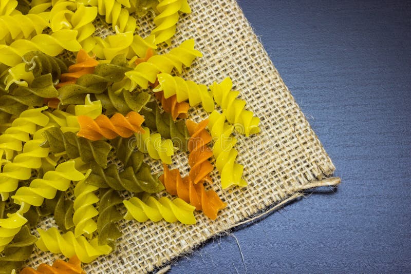 Raw Colored Fusilli Pasta on Burlap with Close-up Stock Image - Image ...