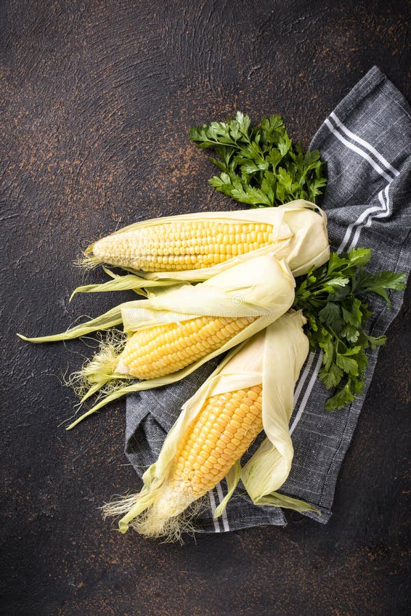 Raw corn on concrete table stock image. Image of agriculture - 157149493