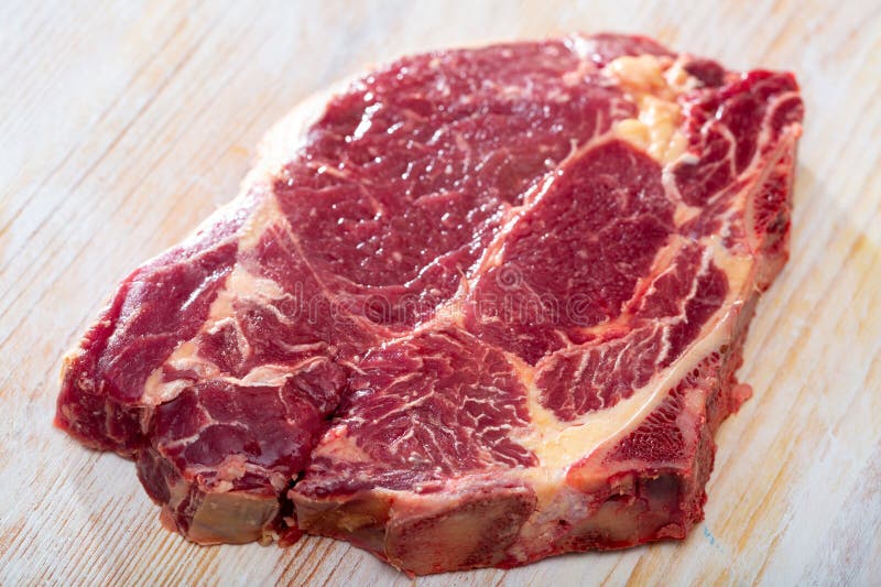 Raw Cow Chop on Natural Wooden Surface, before Cooking Stock Image ...