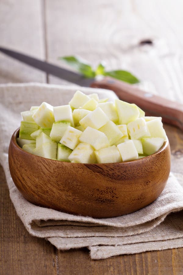 Raw cut fresh squash cubes stock photo. Image of onion - 50389664