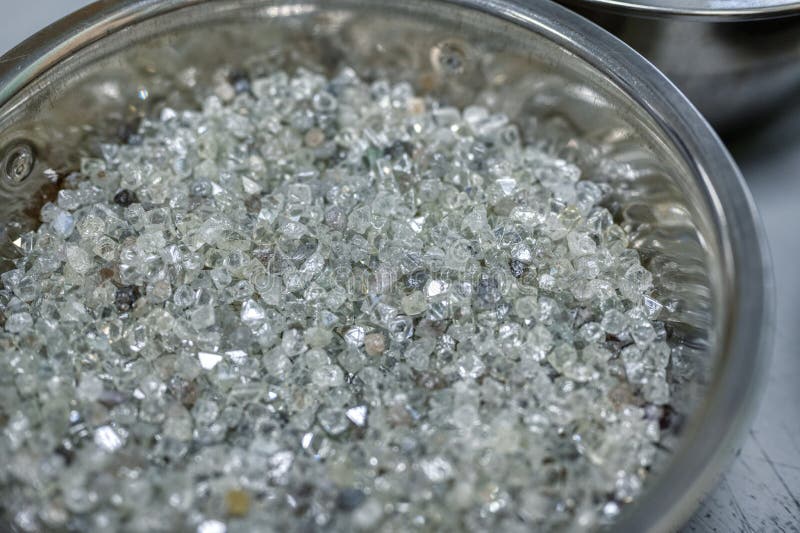 Raw Diamonds in a Steel Cup. the Cups are Full of Valuable Minerals ...