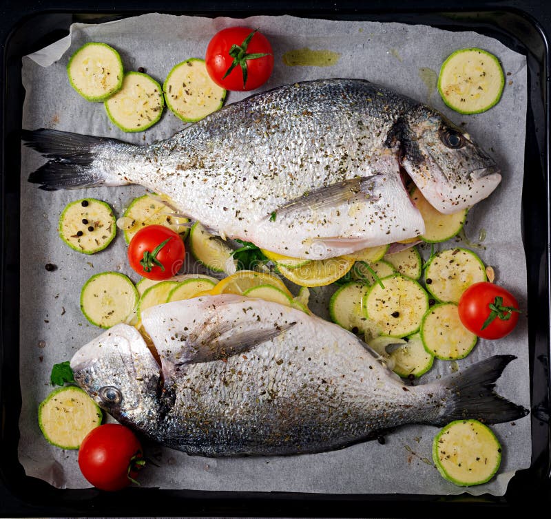 Raw Dorado Fish with Ingredients for Making on a Baking Sheet. Stock ...