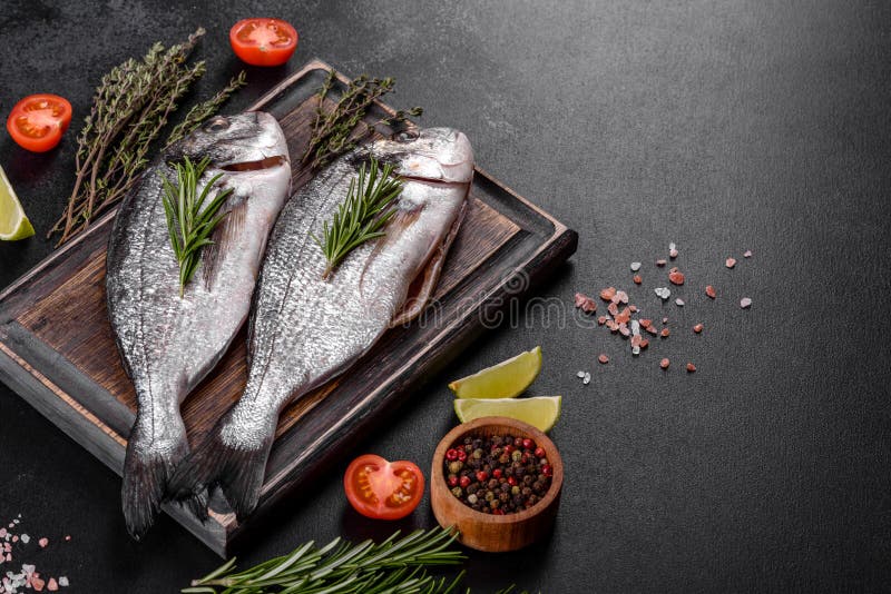 Raw Dorado Fish with Spices Cooking on Cutting Board. Fresh Fish Dorado ...