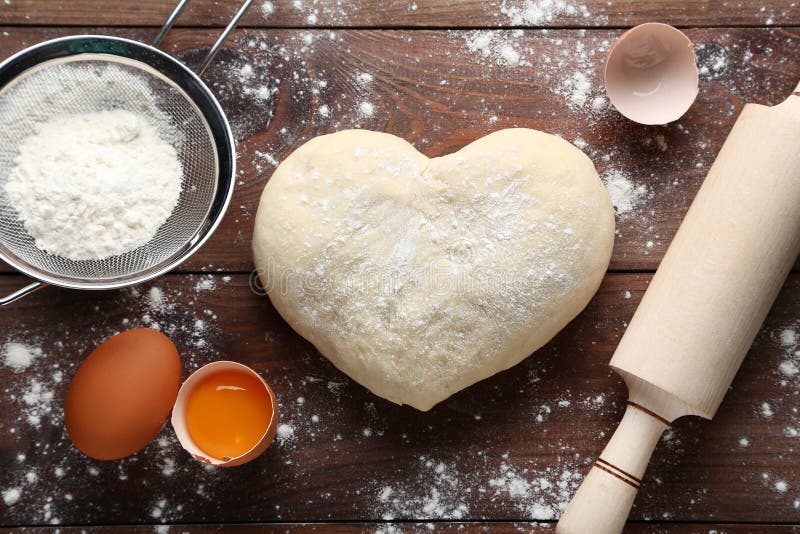 Raw dough in heart shape stock image. Image of bread - 122737367
