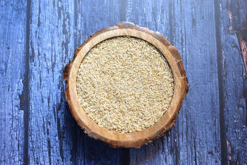 Raw dried brown color rice stock image. Image of healthy - 205782983