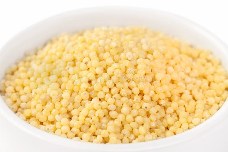 Raw Dried Uncooked Millet Seeds with White Ceramic Plate Macro Stock ...