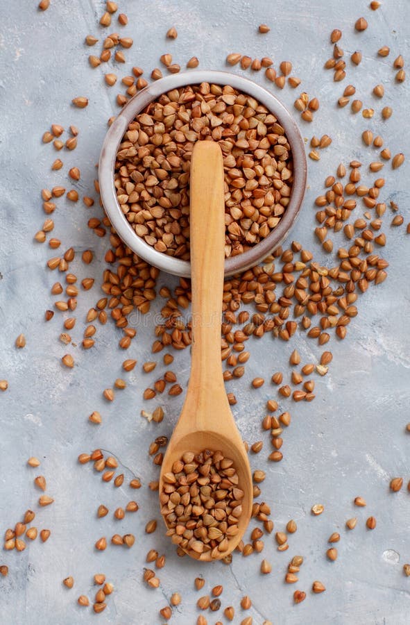 Raw Dry Buckwheat Grain in a Bowl with a Spoon Stock Image - Image of ...