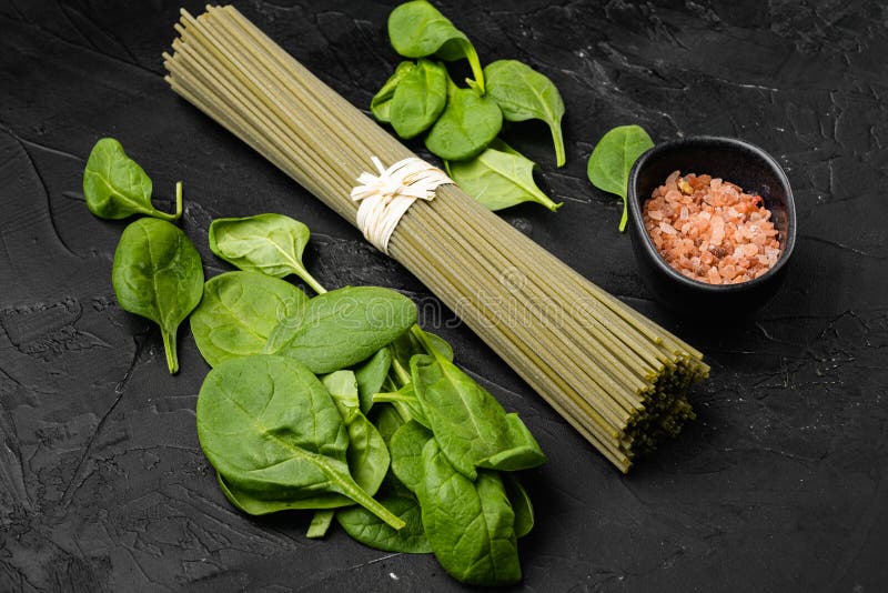 Raw Dry Green Spaghetti with Spinach, on Black Dark Stone Table ...