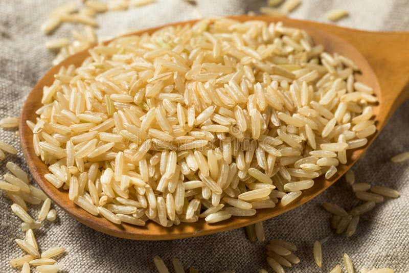 Raw Dry Organic Brown Rice stock photo. Image of cereal - 196014842
