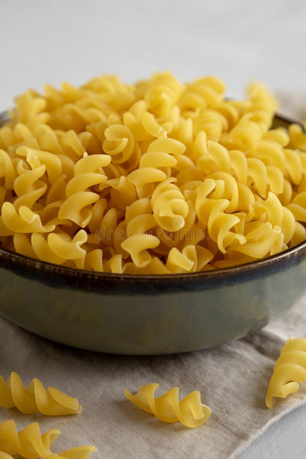 Raw Dry Organic Fusillini Pasta in a Bowl, Side View Stock Photo ...