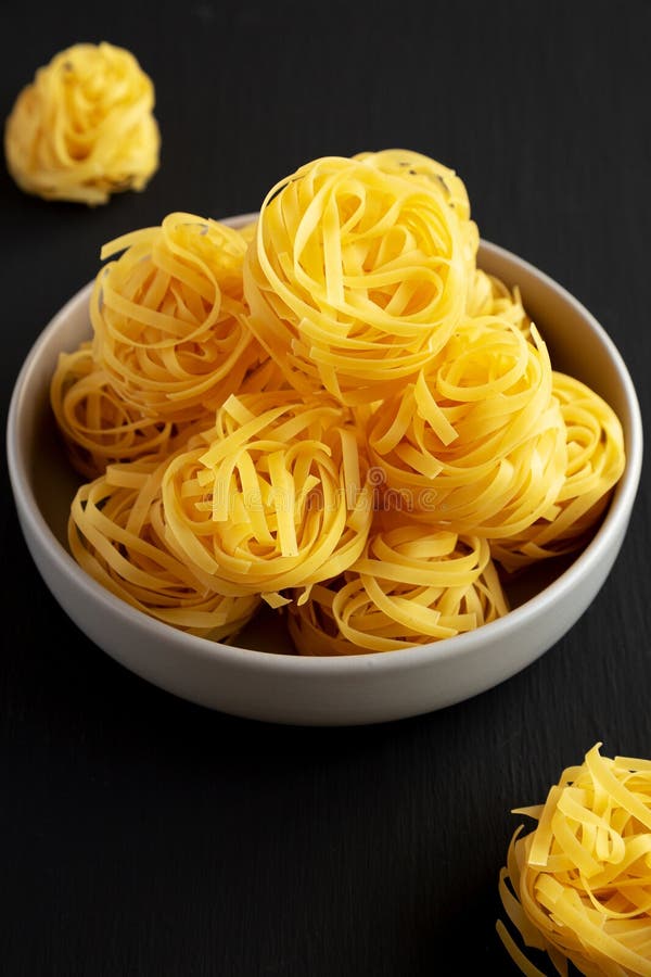 Raw Dry Tagliatelle Pasta in a Bowl, Side View Stock Image - Image of ...
