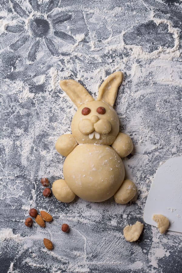 Raw Easter Bunny Buns of Delicious Sweet Dough on a Table Sprinkled ...