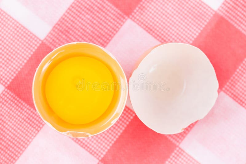 Raw egg on egg shell stock image. Image of ingredient - 56027549