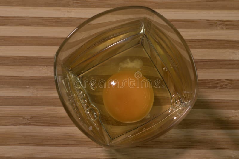 Raw Egg in a Glass Beaker. on a Black Background Stock Image - Image of ...