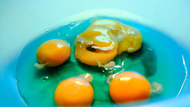 Raw Eggs without Shell.the Egg Flows and Falls into the Cup. Egg White ...
