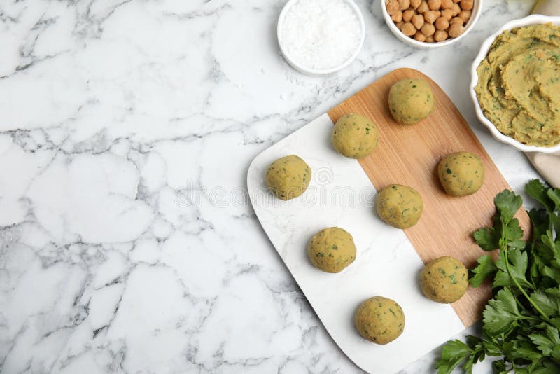 Raw Falafel Balls and Ingredients on White Marble Table, Flat Lay ...