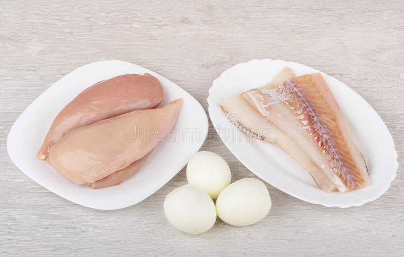 Raw Fillet of Chicken Breast and Pollock, Boiled Eggs Stock Photo ...