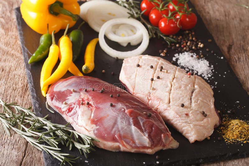 Raw Fillet of Duck with Vegetables and Spices Close-up on the Ch Stock ...