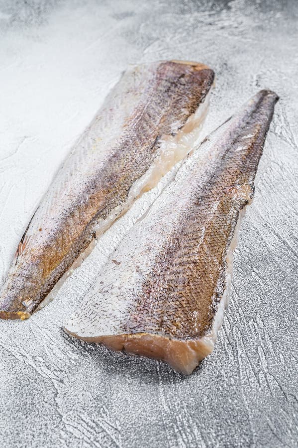 Raw Fillet of Hake Fish. White Background Stock Photo - Image of pieces ...