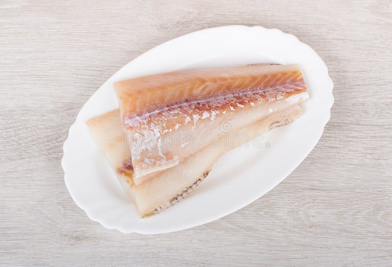 Raw Fillets of Pollock in Plate Stock Photo - Image of plate, glass ...