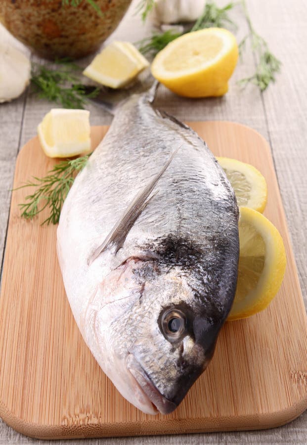 Raw fish stock image. Image of preparation, herb, food - 24678413