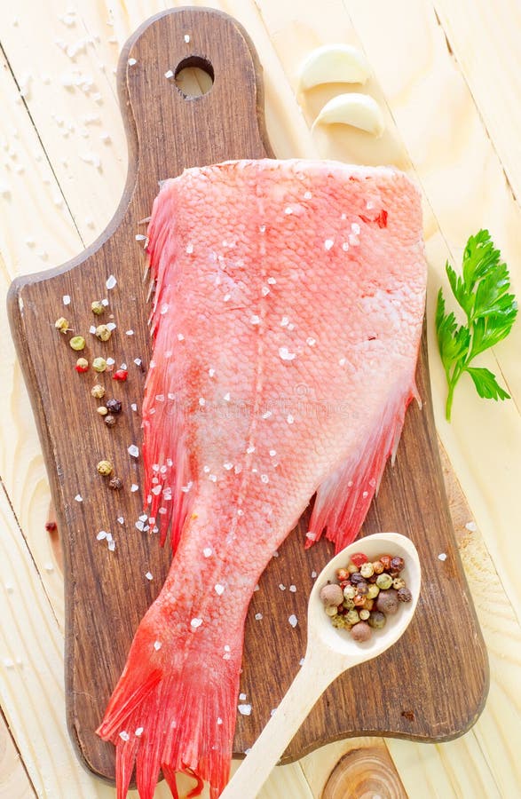 Raw fish on board stock photo. Image of ingredient, fresh - 33862978