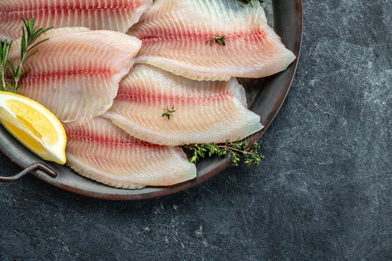 Raw Fish Fillet with Lemon and Spices on a Dark Background. Long Banner ...