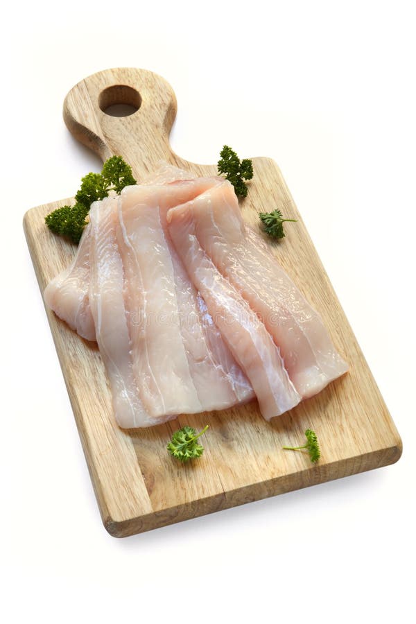 Raw Fish Fillets on Board Over White Stock Image - Image of fillet ...