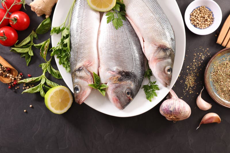 Raw fish and ingredient stock photo. Image of diet, garlic - 207834830