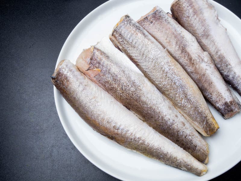 Raw Fish Hake on White Plate Stock Image - Image of pieces, meat: 140547501