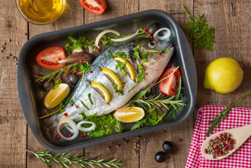 Raw fish ready for cooking stock photo. Image of lemon - 93086826