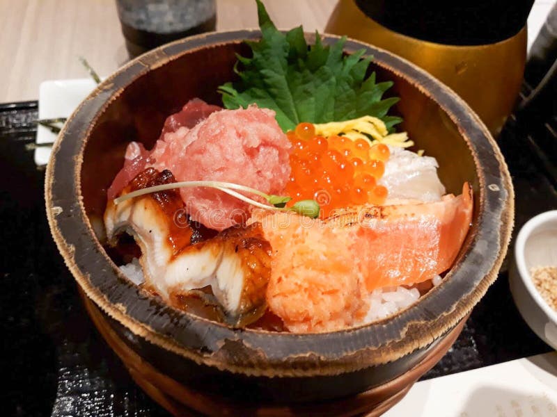 Raw Fish Over Rice with Eel and Fish Roe Stock Photo - Image of bowl ...