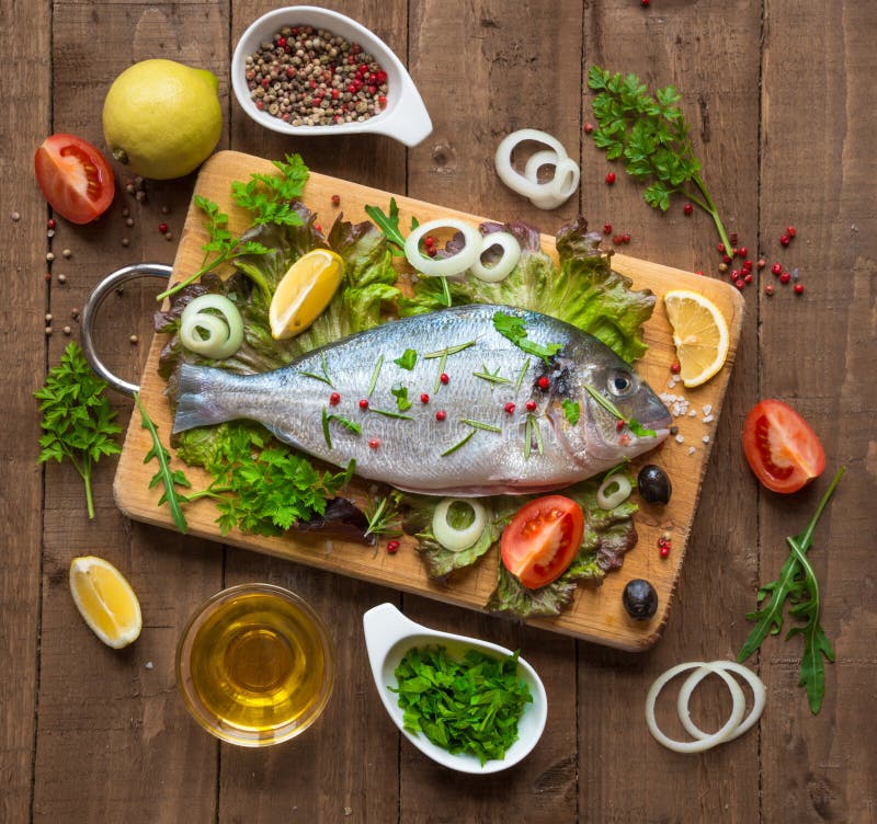 Raw fish ready for cooking stock image. Image of lemon - 93086839