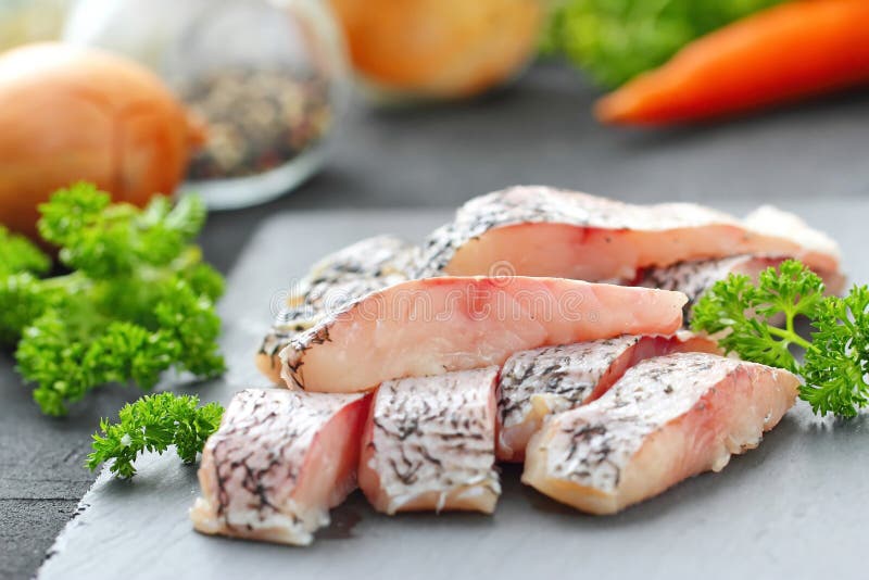Raw fish ready for cooking stock photo. Image of grass - 110161770