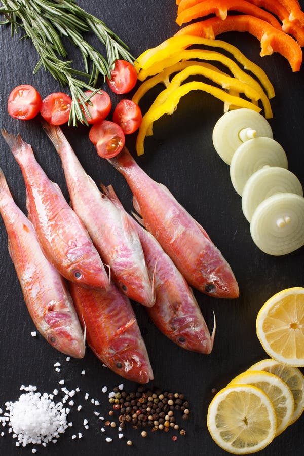 Raw Fish Red Mullet with Ingredients Close-up on the Table. Vert Stock ...
