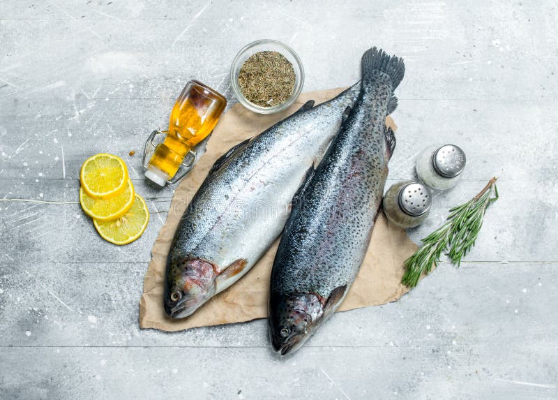 Raw Fish Salmon with Lemon Wedges, Rosemary and Spices Stock Photo ... Raw Fish Salmon with Lemon Wedges, Rosemary and Spices Stock Photo ...