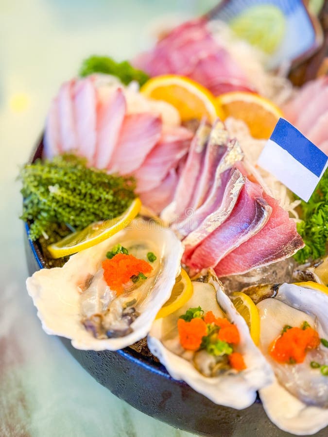 Raw Fish Slice and Oyster Serve on the Table Stock Photo - Image of ...