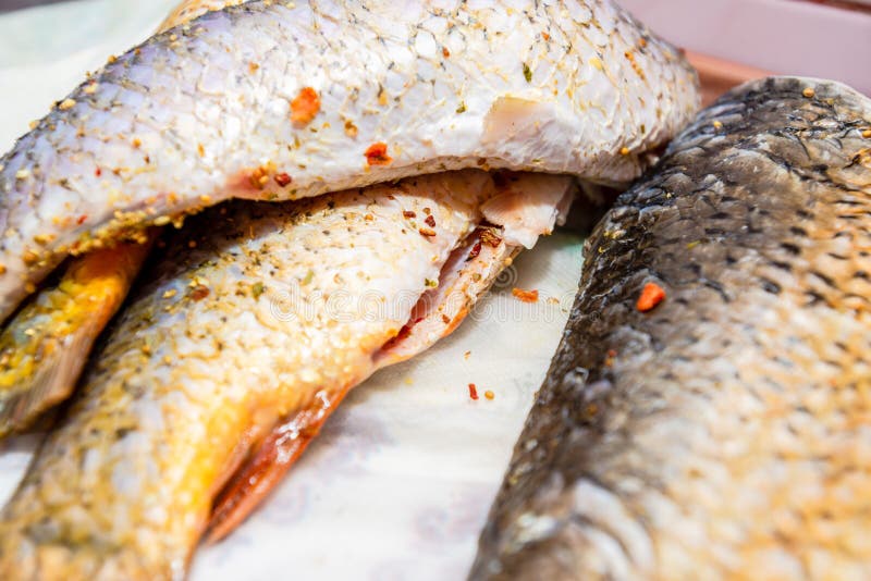 Raw Fish with Spices Cooking on the Table. Seafood Concept Stock Photo ...
