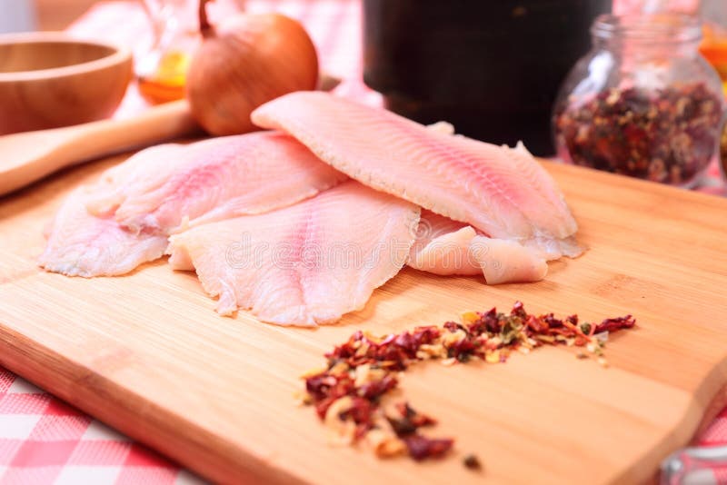 Raw Fish Tilapia on Cutting Board and Spices Stock Image - Image of ...
