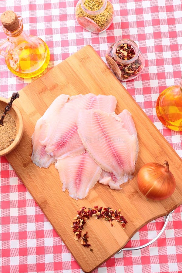 Raw Fish Tilapia on Cutting Board and Spices Stock Image - Image of ...