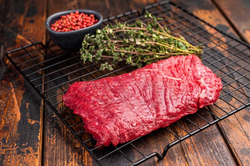 Raw Flank Steak, Beef Meat Ready for BBQ. Wooden Background Stock Photo ...